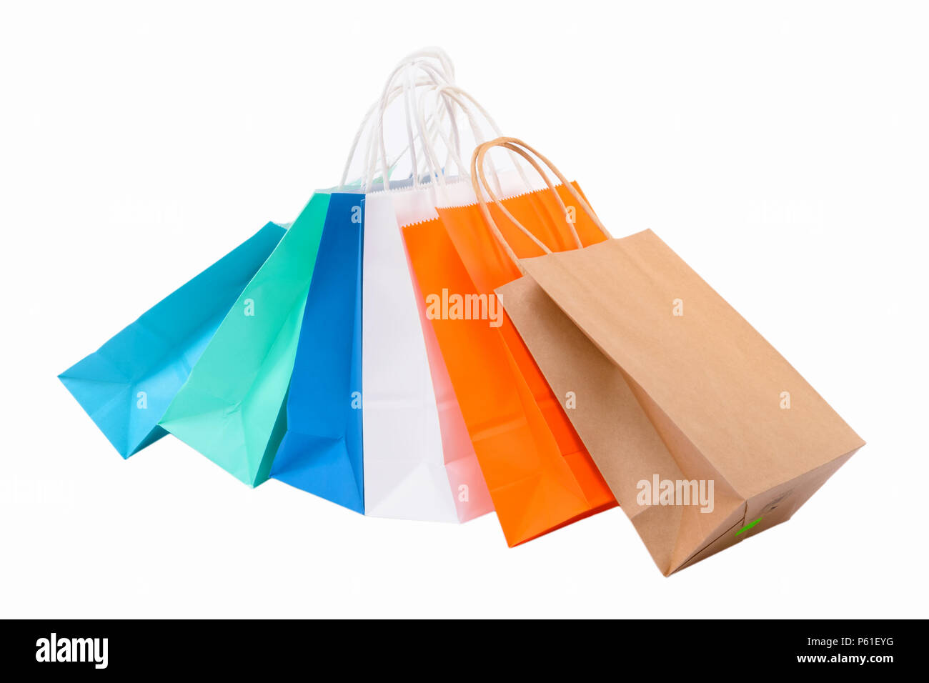 Variety of colored paper shopping bags on white background. Empty area ...