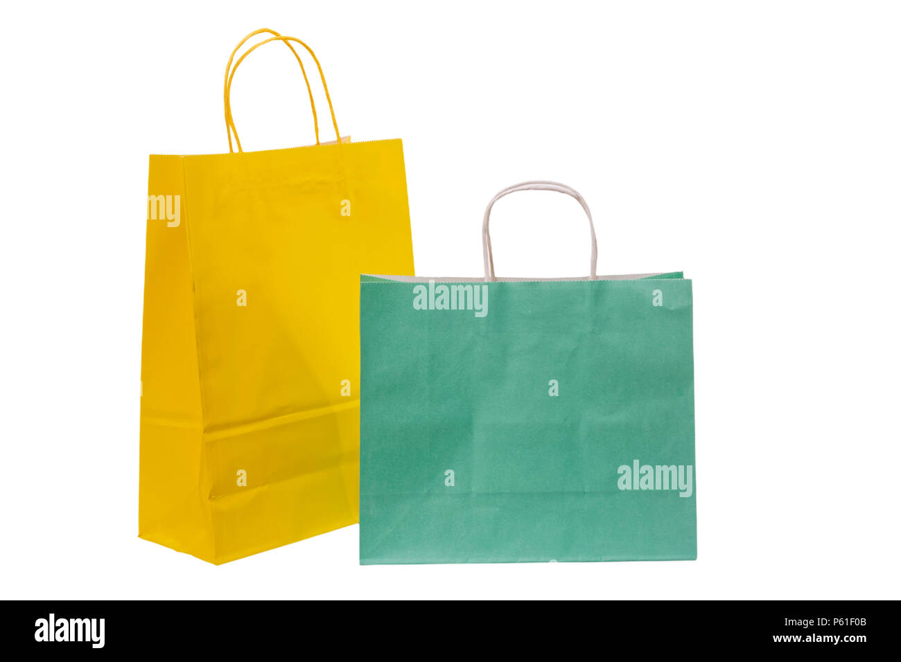 Variety of colored paper shopping bags on white background. Empty area ...