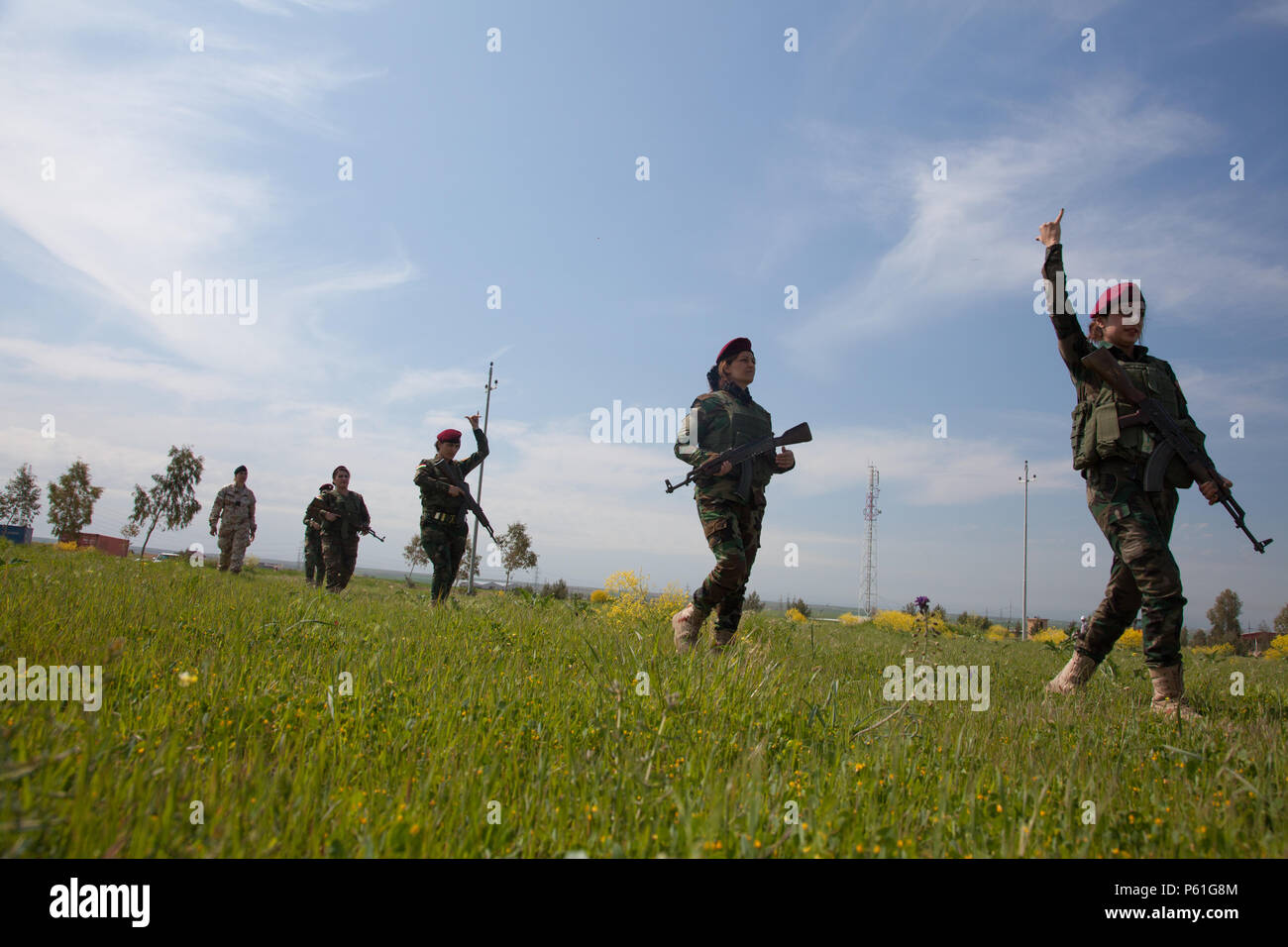 A Female Zeravani soldier signals her squad to take cover during a ...