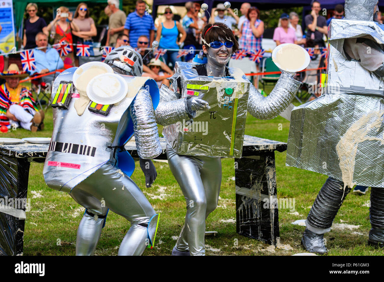 The PieBots Team, people dressed as robots, throwing custard pies ...