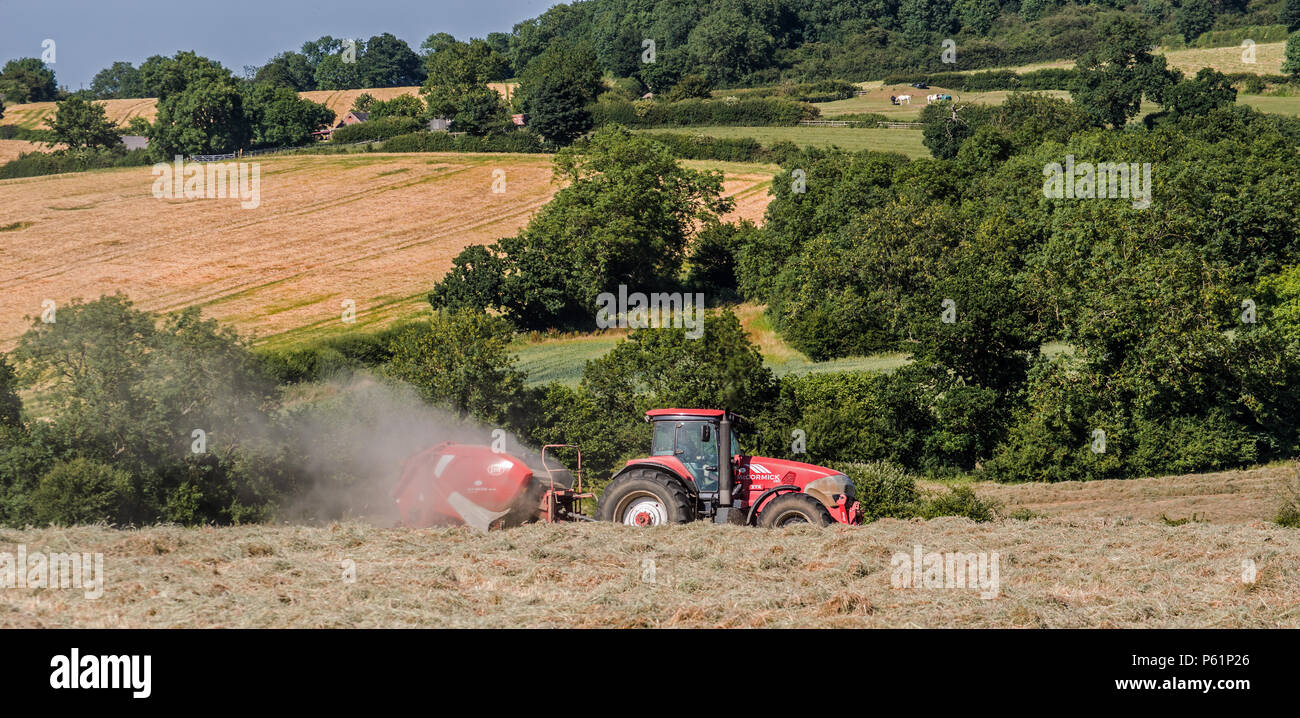 Farming in England with a Big Red Tractor Stock Photo - Alamy