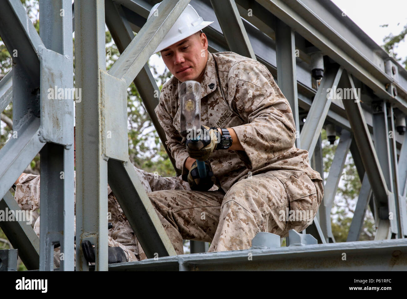 MARINE CORPS BASE CAMP PENDLETON, Calif. - Sgt. Chris Piette helps ...