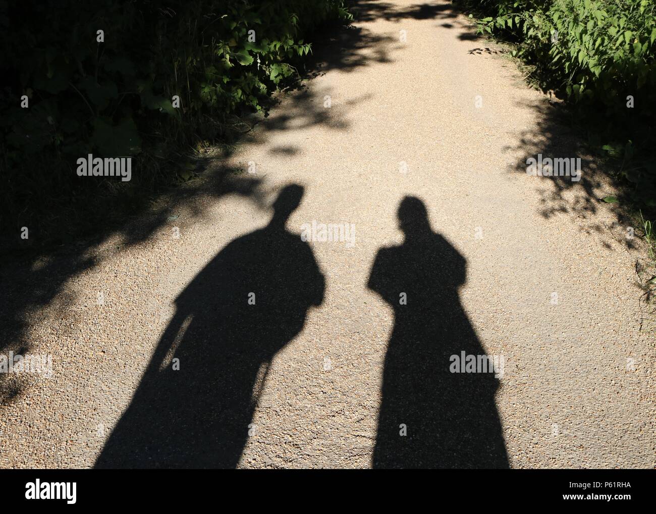 Two people shadows Stock Photo - Alamy