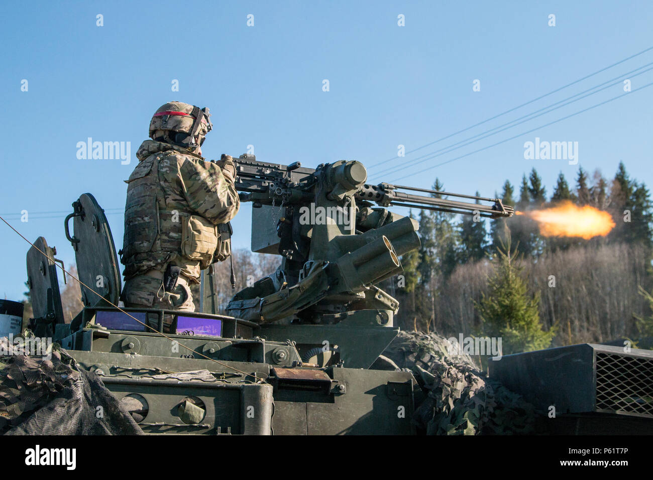 An L Troop, 3rd Squadron, 2nd Cavalry Regiment Soldier fires a M2 .50 ...