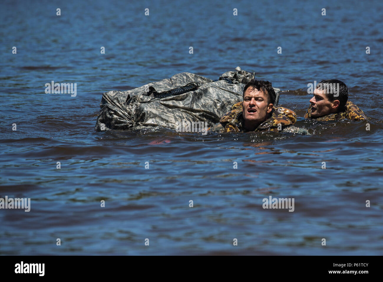 U.S. Army Soldier's swim with there equipment across Victory pond ...