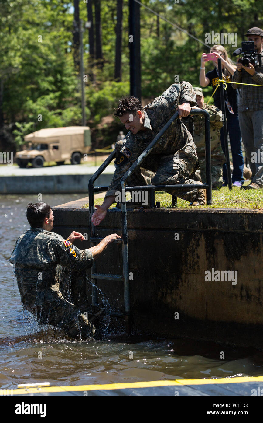 U.S. Army Capt. Dave Matthews (right), assigned to 25th Infantry ...