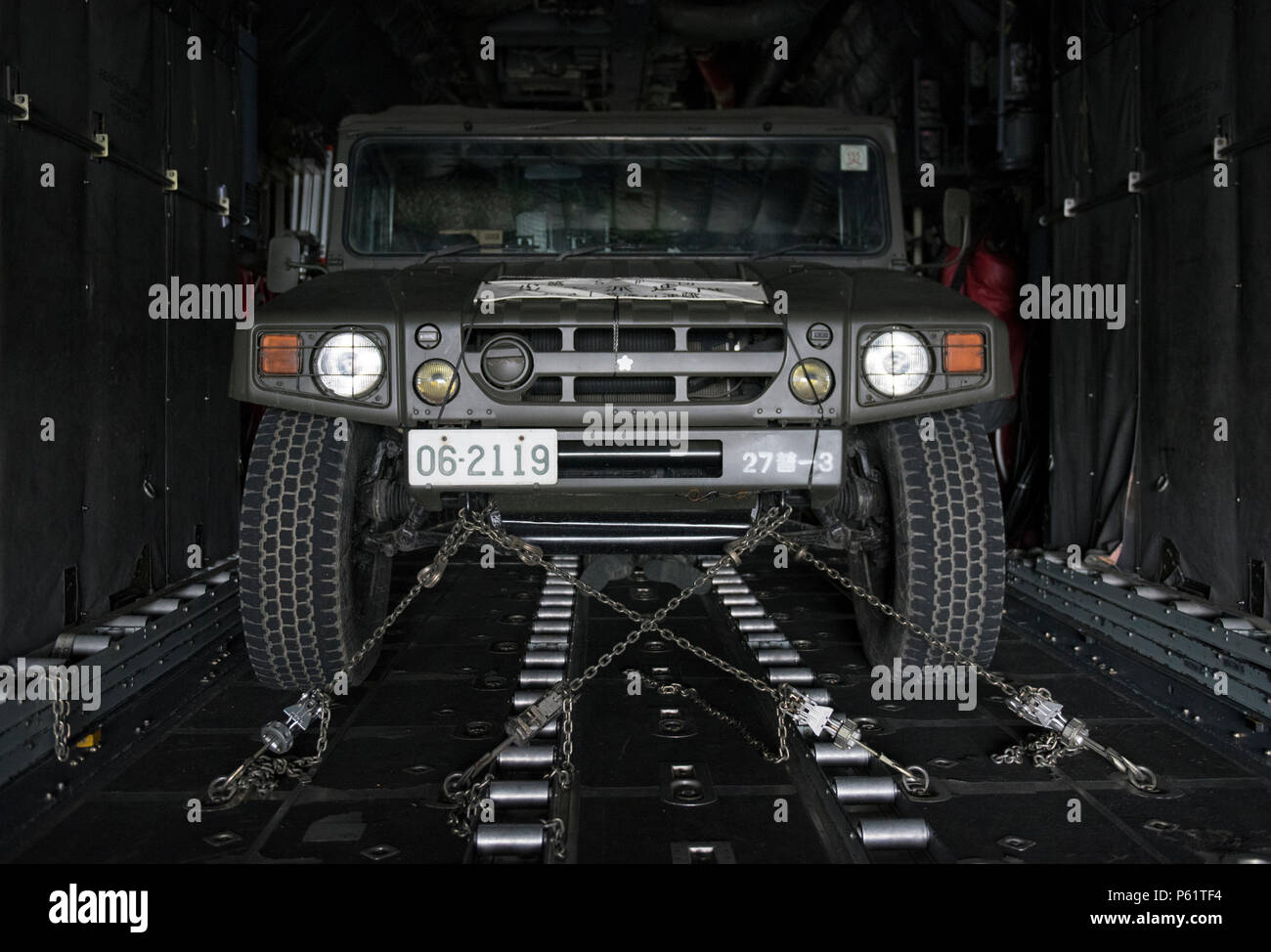 A Japan Ground Self-Defense Force vehicle sits strapped down in a U.S ...