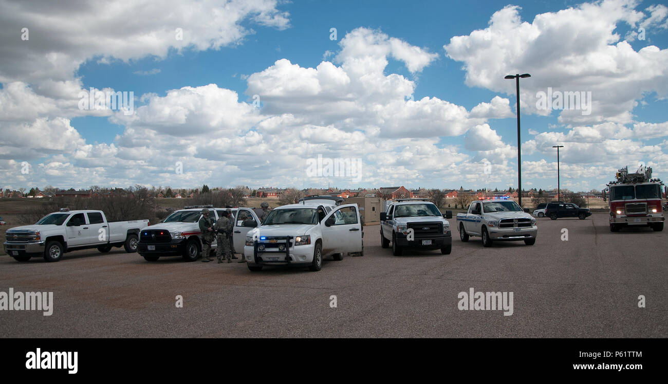 Security Forces vehicles and a fire truck sit in a staging area for an ...