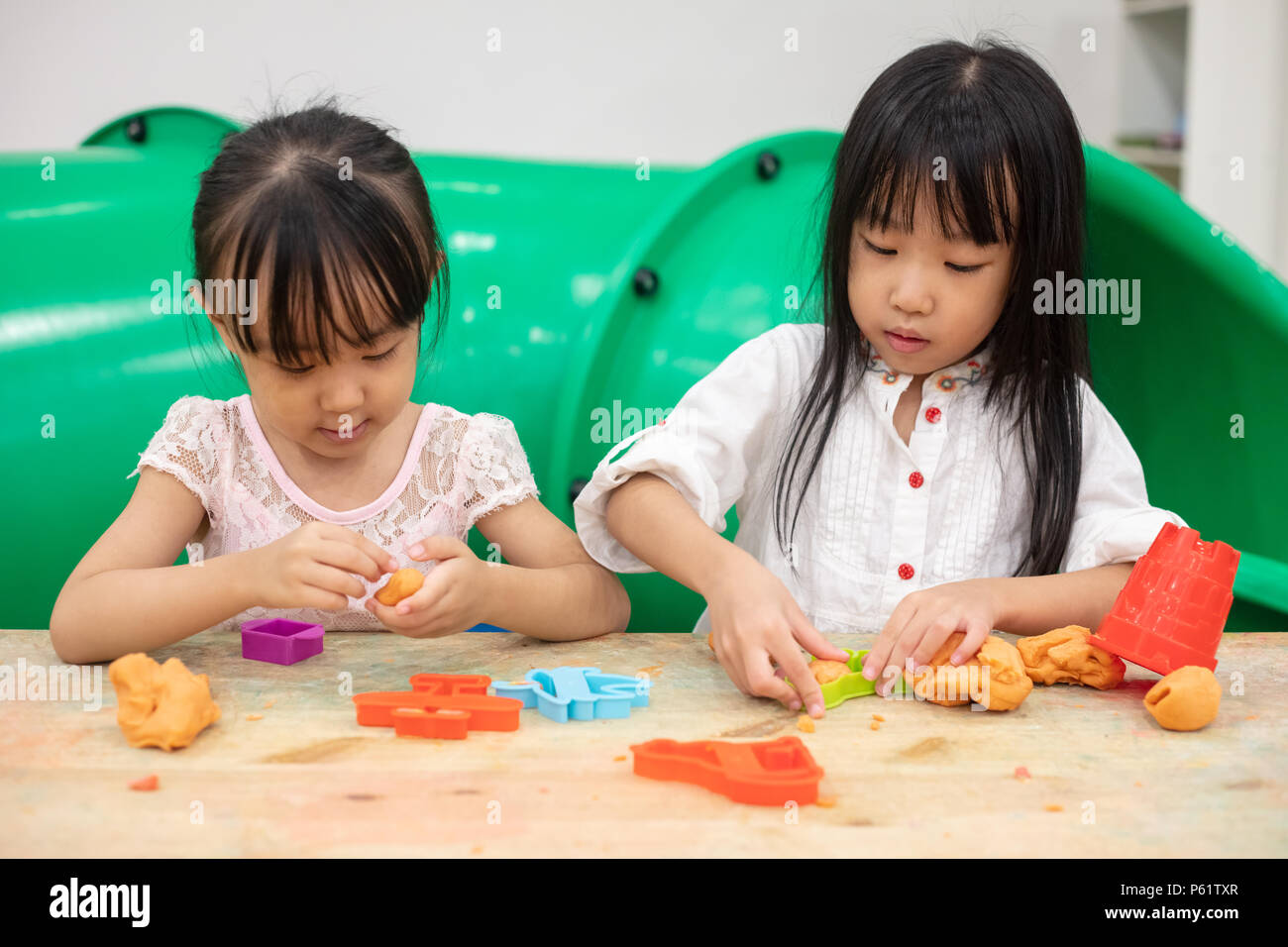 Siblings playing with clay hi-res stock photography and images - Alamy