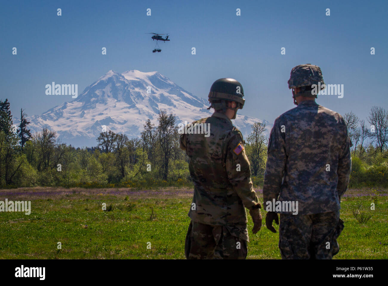 U.S. Army Soldiers assigned to 17th Field Artillery Brigade watch as a ...
