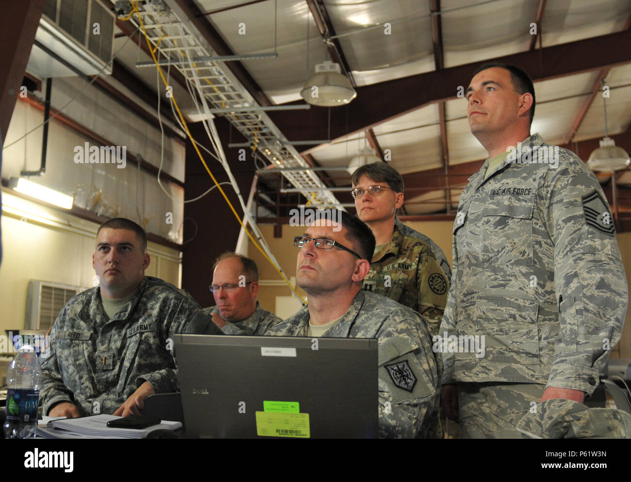 National Guard soldiers and airmen of the Blue Team listen to their ...