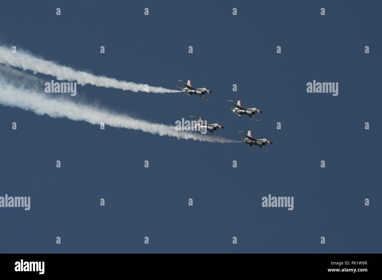 The Thunderbird pilots perform the Trial to Diamond Loop maneuver ...