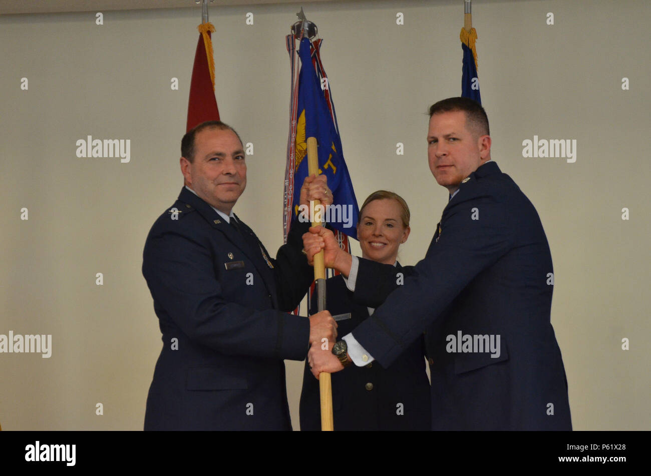 Lt. Col. Timothy Murphy accepts the unit flag from Col. Ralph Schwader ...