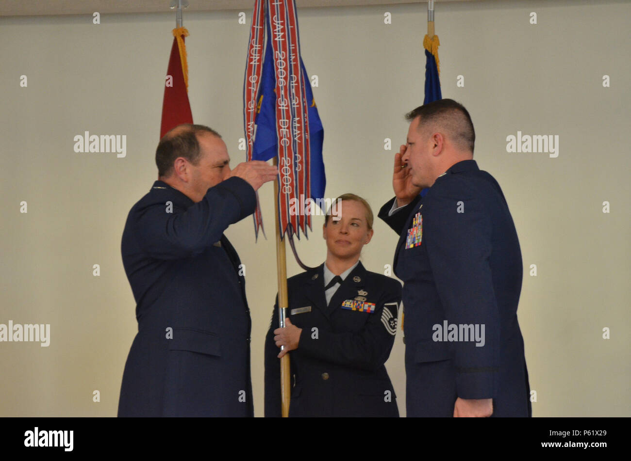 Lt. Col. Timothy Murphy accepts the unit flag from Col. Ralph Schwader ...