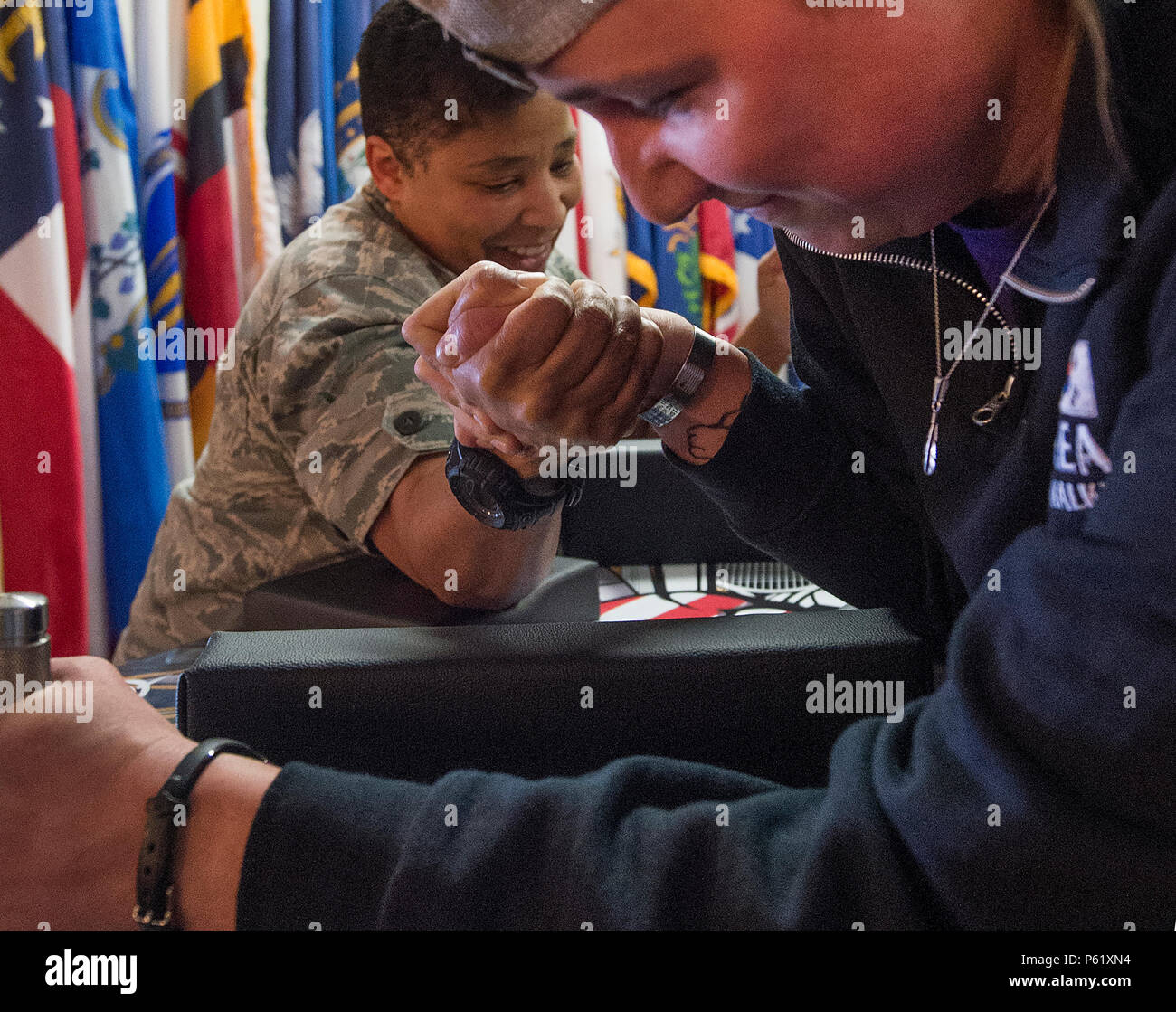 Katie Moorkamp takes down Michelle Stringer in an arm wrestling match ...