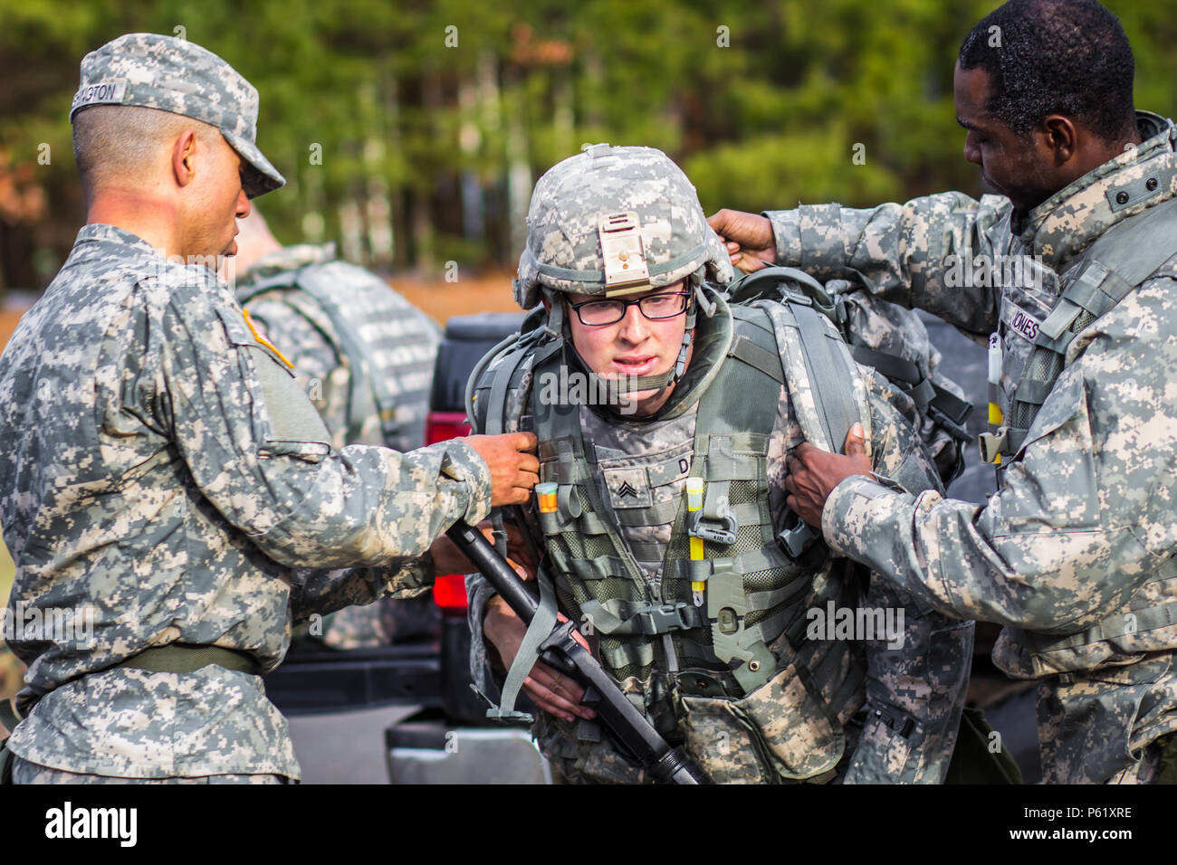 Competitors SSG William Washington and Sgt Wayne Jones help SGT John ...
