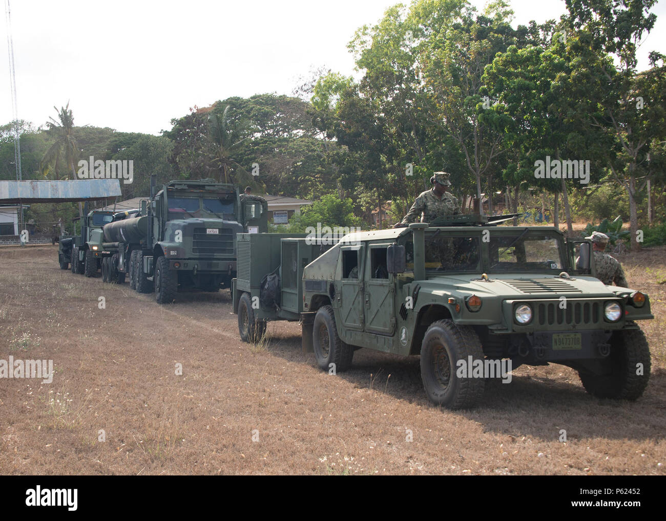 U. S. Navy Seabees and U. S. Marines prepare to set up a Central ...
