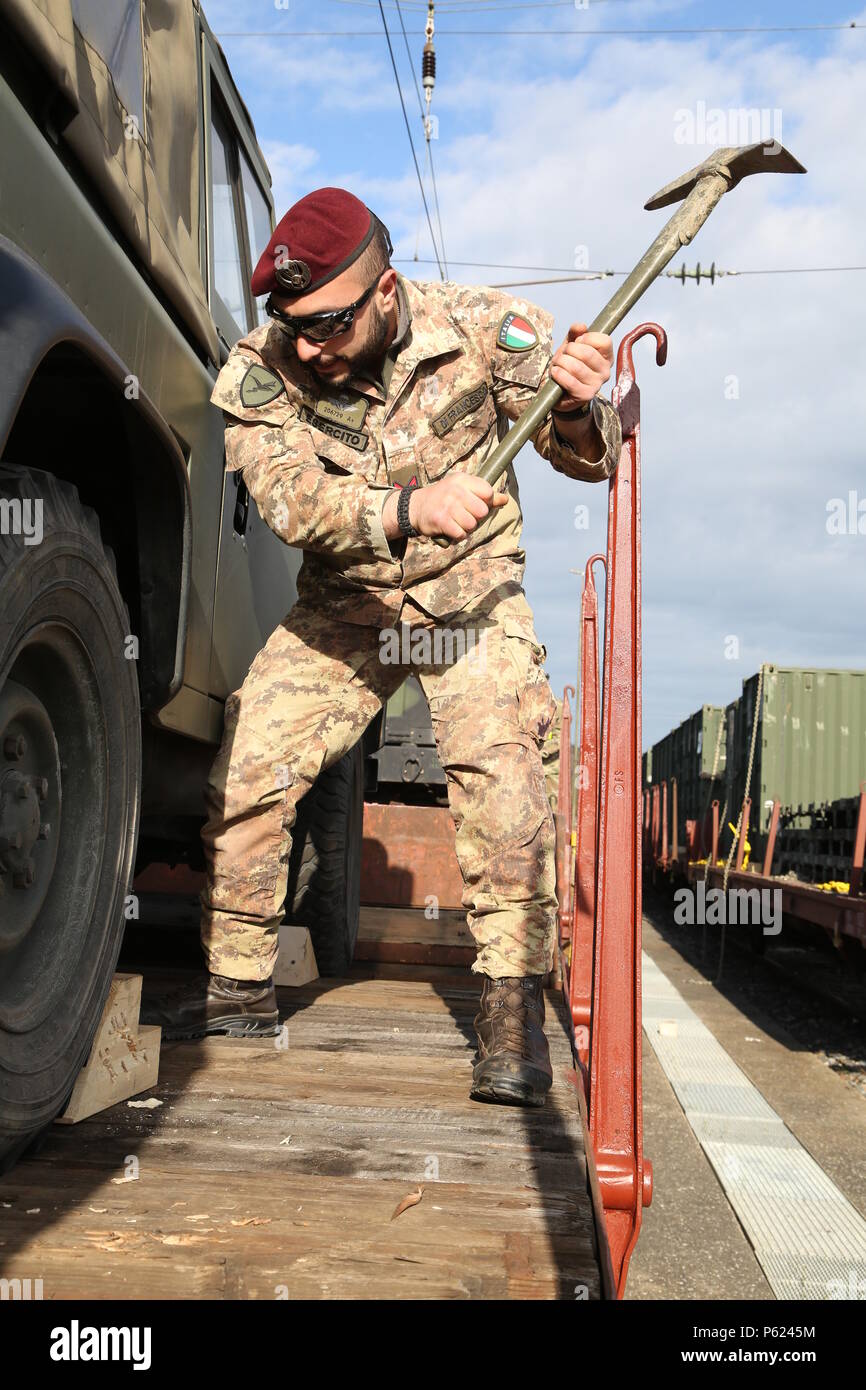 An Italian Soldier of Folgore Parachute Brigade removes a chalk block ...