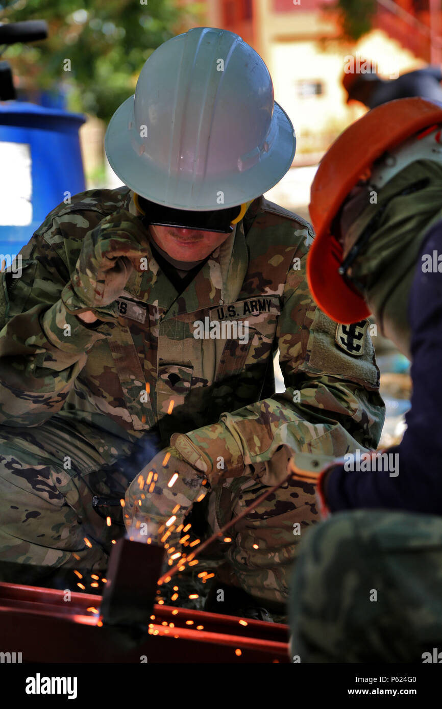 Philippine Navy 1st Class steelworker Darwin G Ballecer welds a roof ...