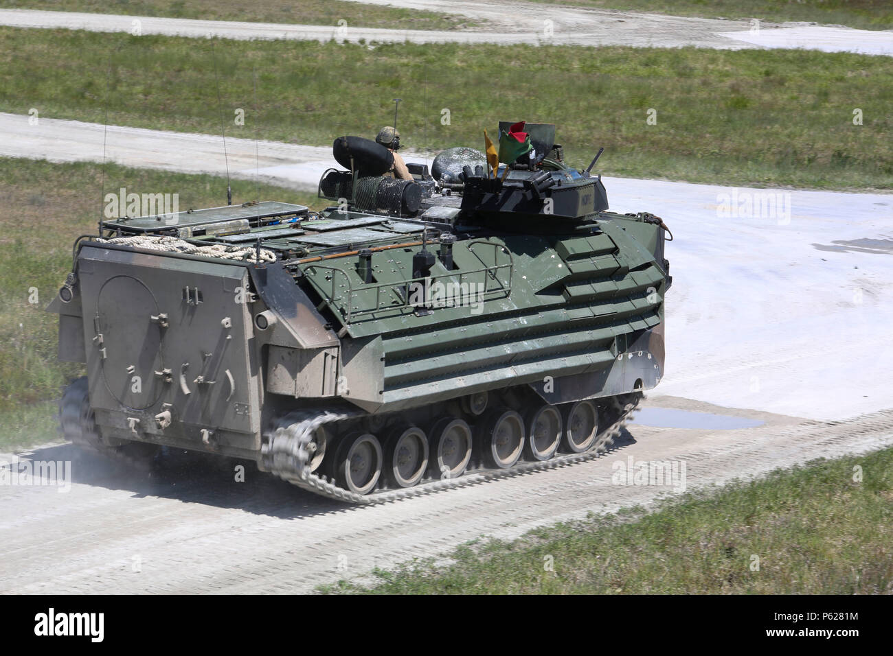 Marines with Alpha Company, 2nd Assault Amphibian Battalion maneuver ...