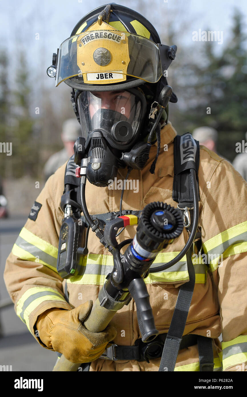 U.S. Air Force Airman 1st Class Thomas Barker, a fire protection ...
