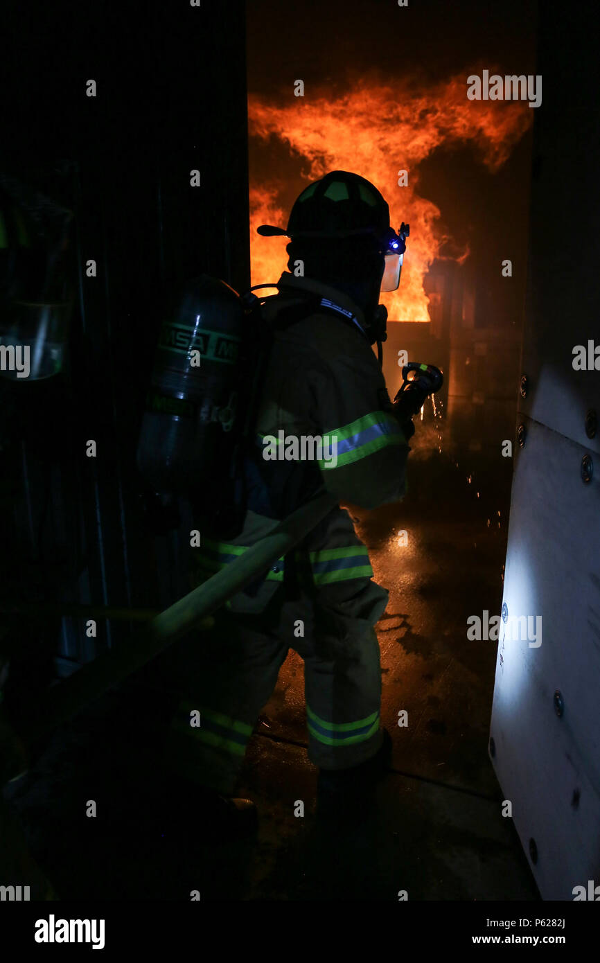 A U.S. Air Force fire protection specialist assigned to the 673rd Civil ...