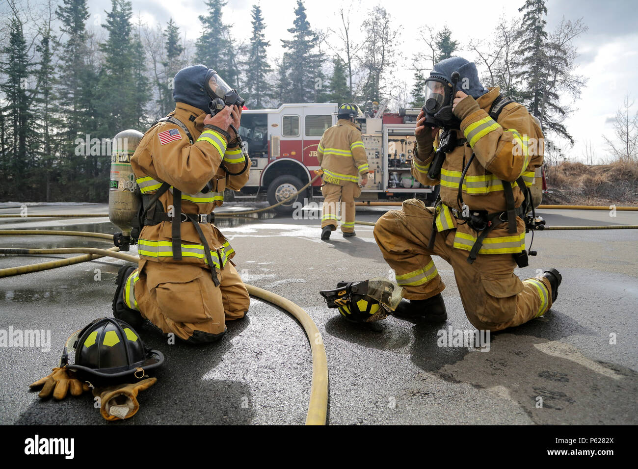 U.S. Air Force fire protection specialists, assigned to the 673rd Civil ...