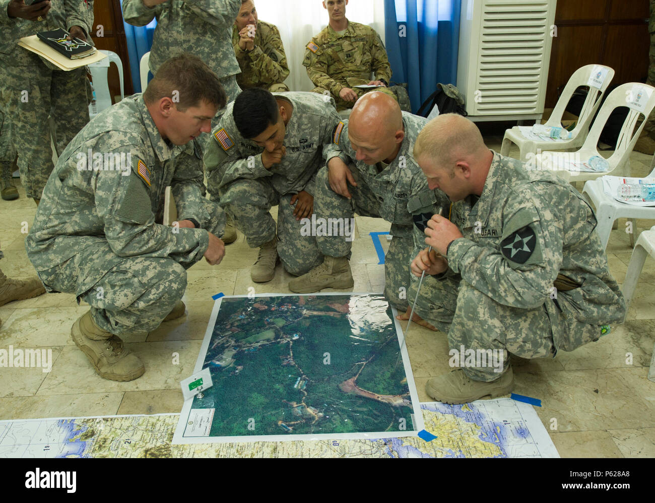 CAMP AGUINALDO, Philippines. – U.S. Army Soldiers examine a map during ...