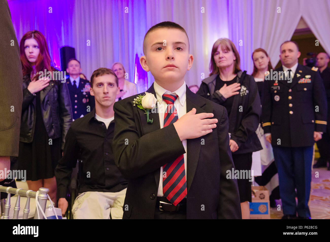 Christian Fagala stands during the playing of the National Anthem at ...