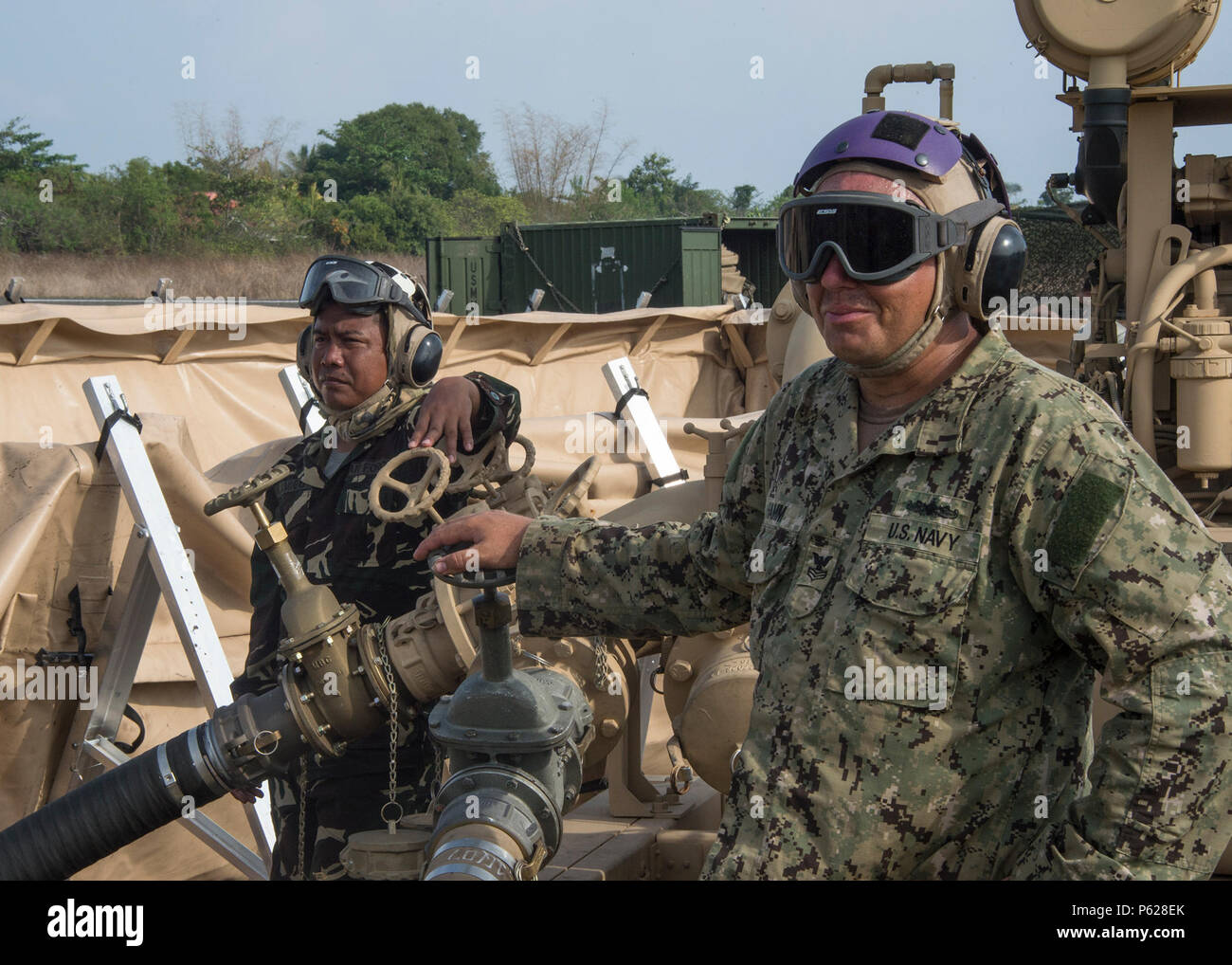 Boatswain Mate 1st Class Russell Hamm and a Philippine Air Force member ...