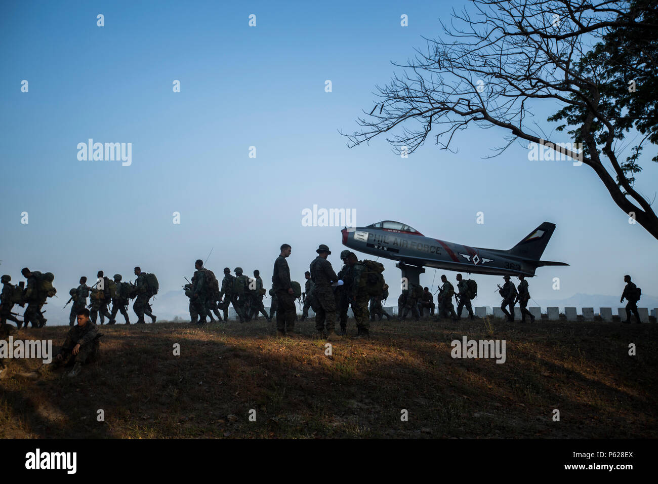 U.S. and Philippine Marines prepare to board a MV-22B Osprey during ...