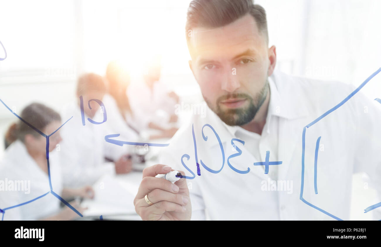 closeup of a serious scientist working with formulas Stock Photo - Alamy