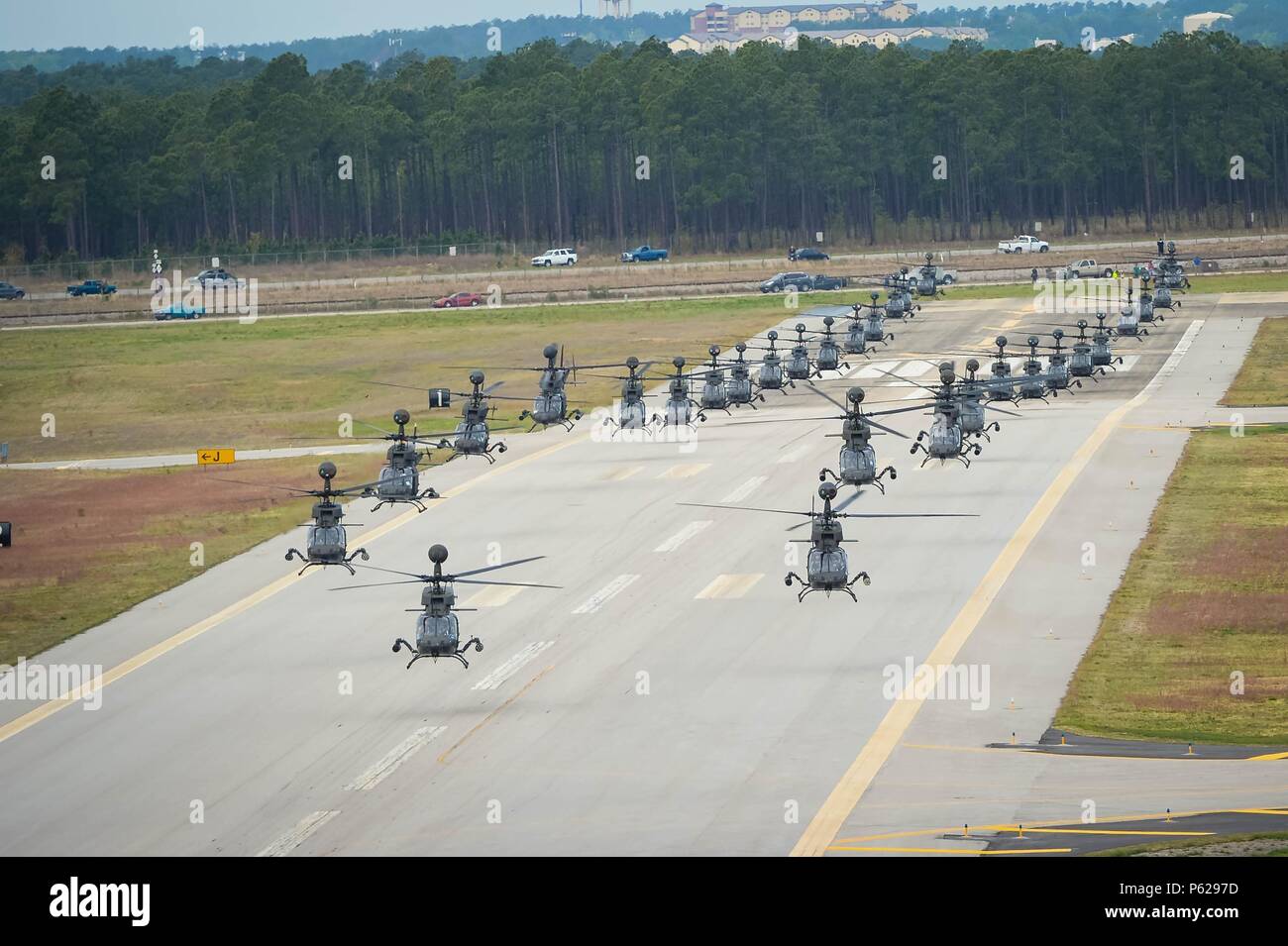 Thirty-two OH-58D Kiowa Warriors lead by the squadron commander of the ...