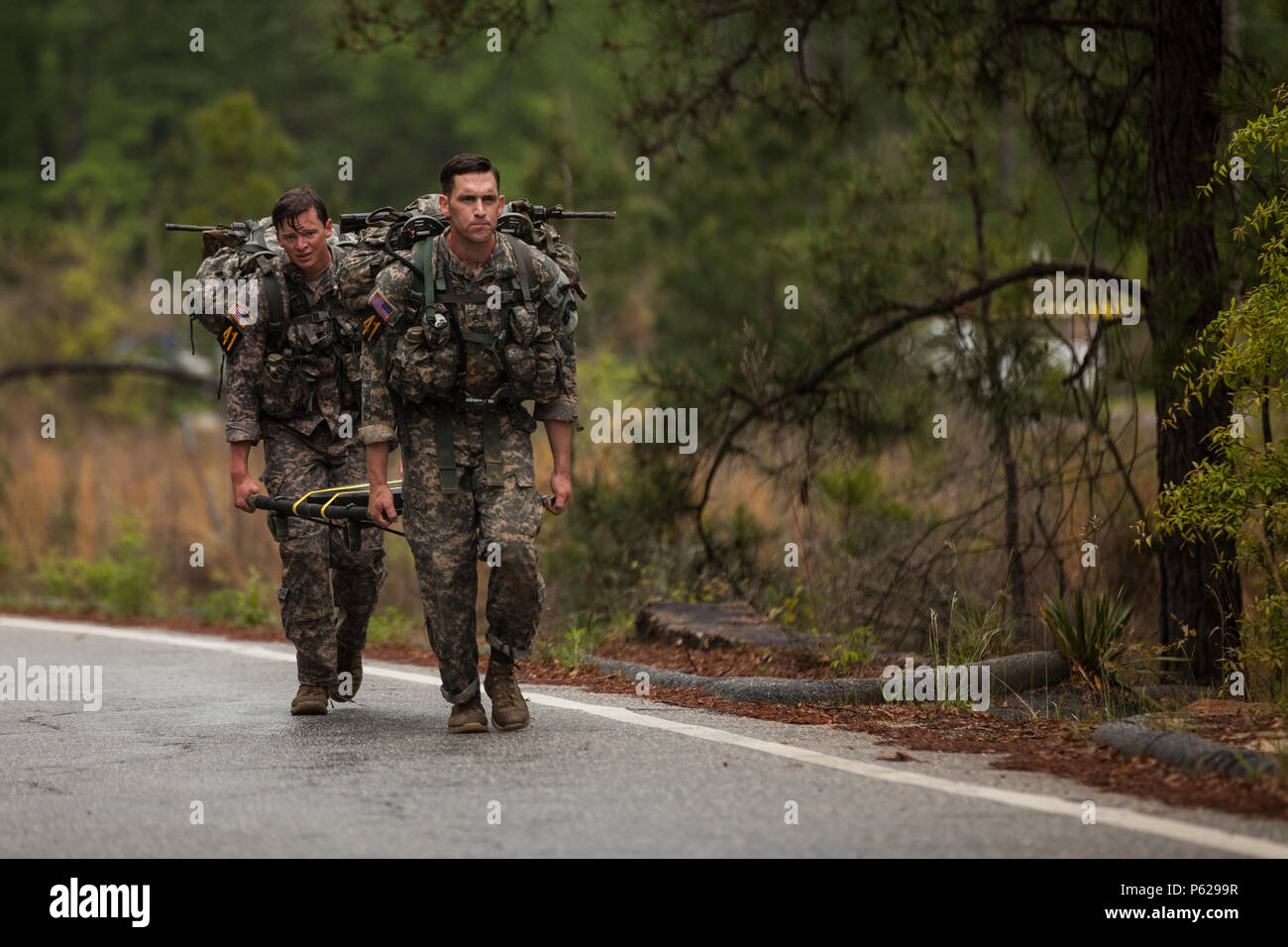 U.S. Army Spc. Victor Black (left) and Staff Sgt. Nicholas Vandre ...