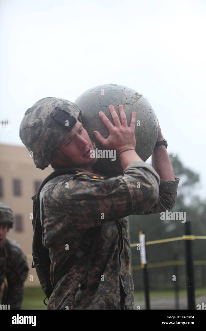A U.S. Army Ranger carriers an Atlas ball from one point to another ...