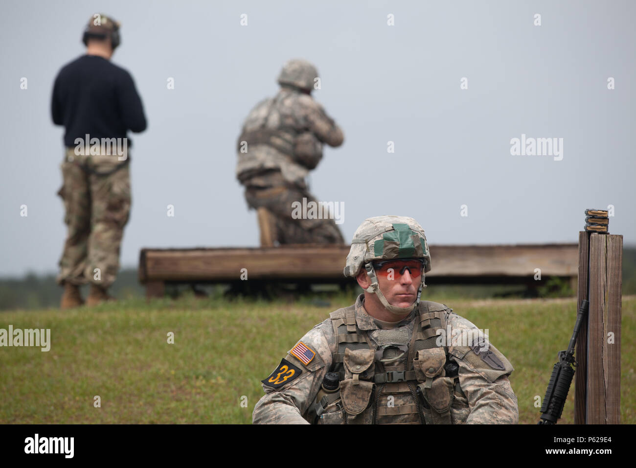 U.S. Army Staff Sgt. Joshua Rolfes waits patiently for his battle buddy ...