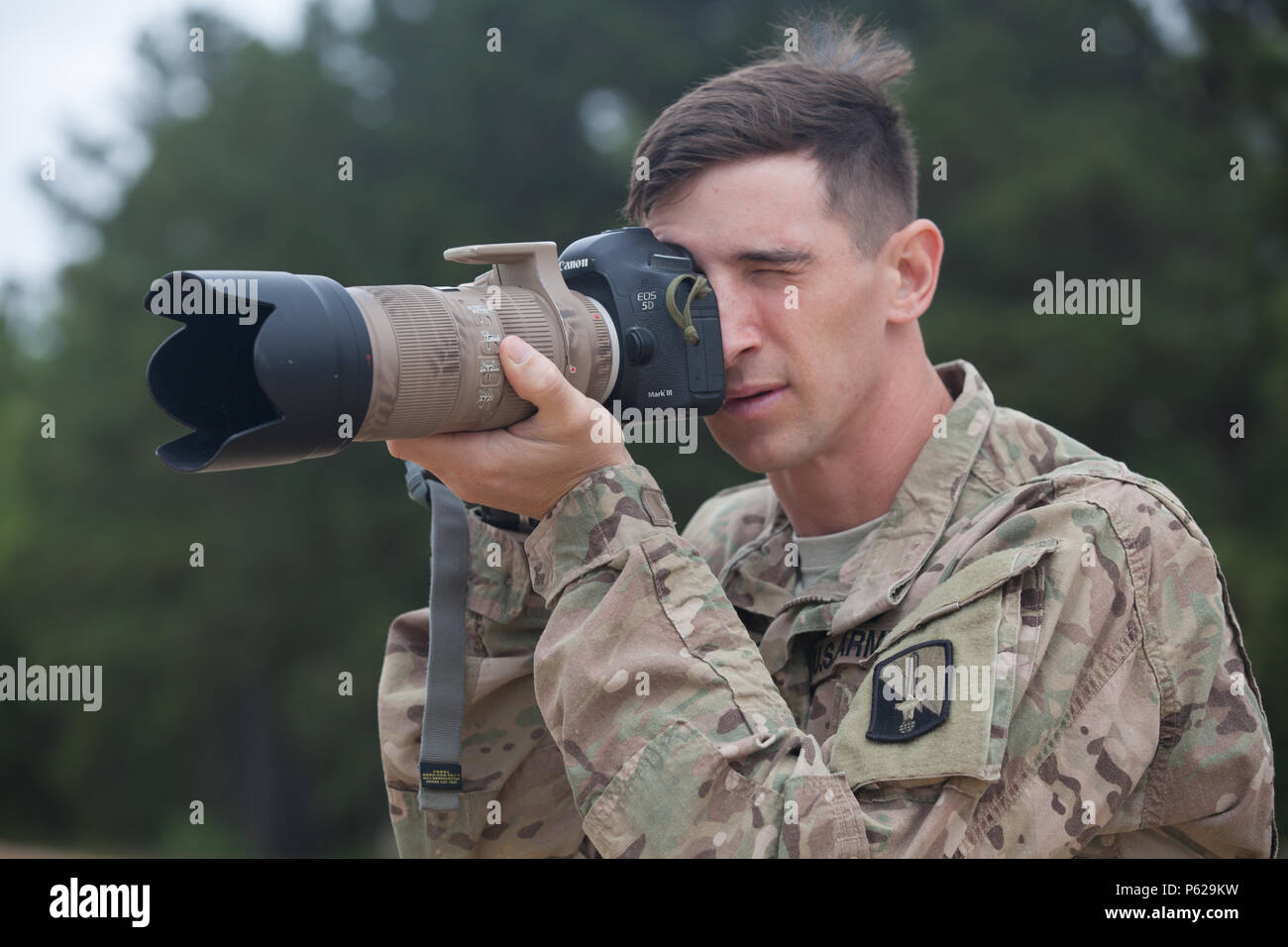 U.S. Army Spc. Steve Hitchcock, assigned to the 55th Combat Camera ...