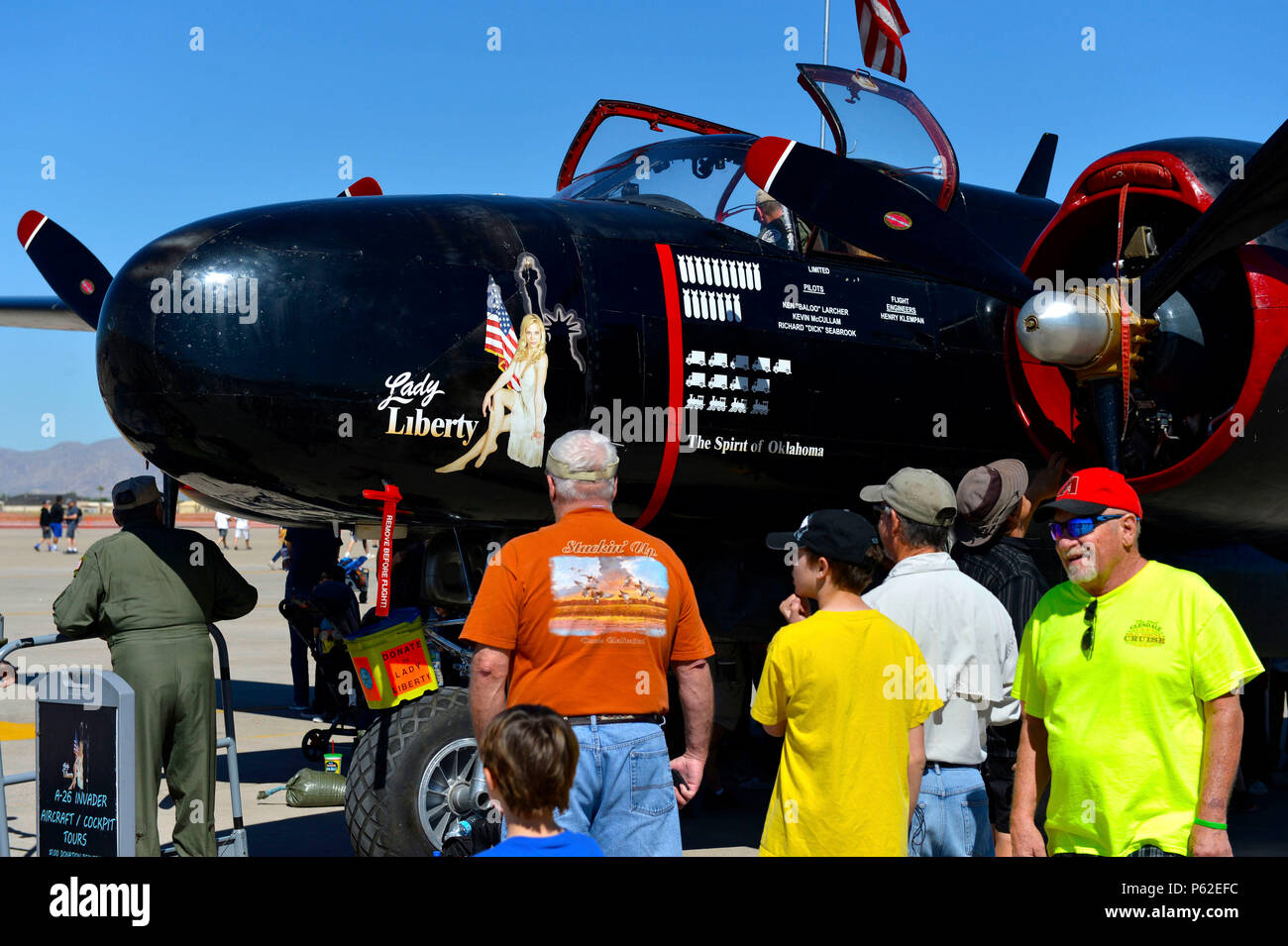People gather to view an A-26 invader aircraft at the 75 years of ...