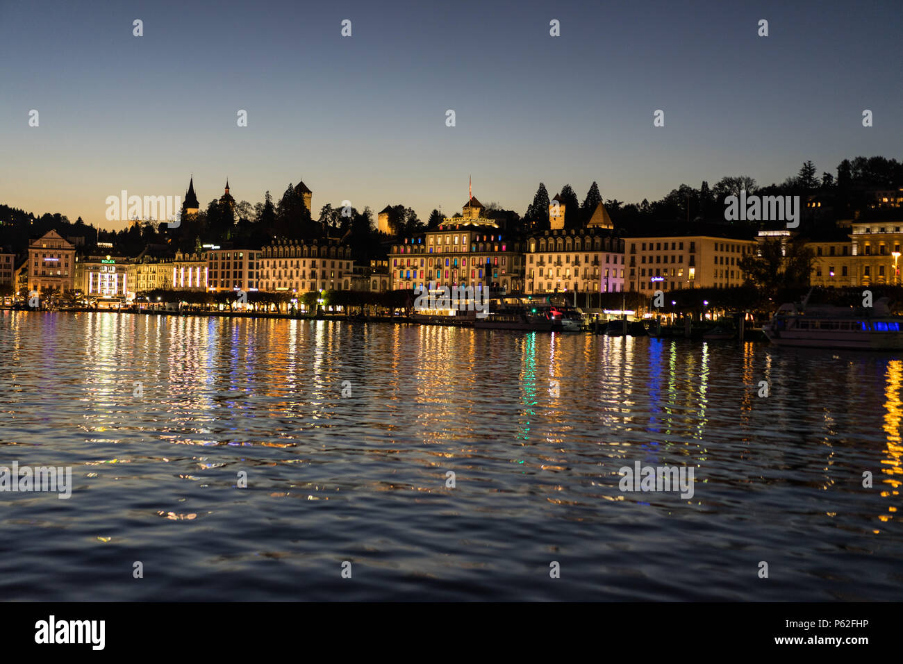lucerne city by night with lake viewed from boat with city lights Stock ...