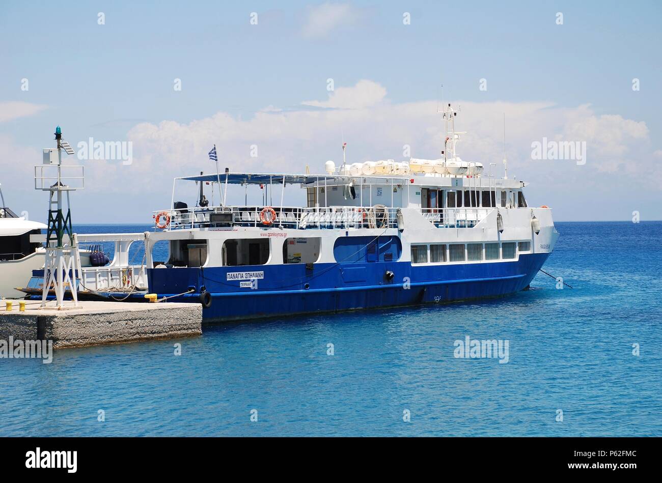 Passenger ferry boat Panagia Spiliani moored at Livadia harbour on the ...