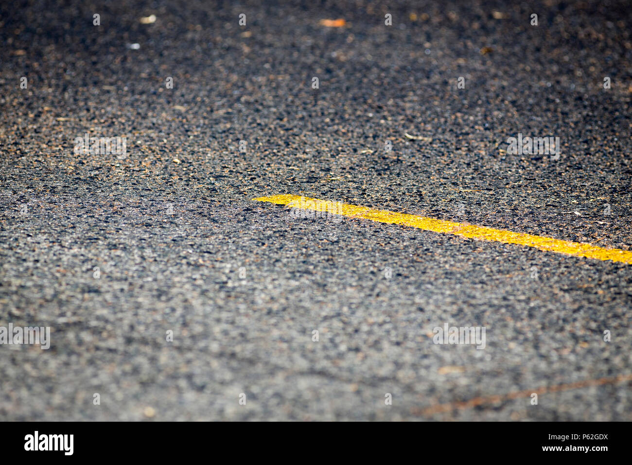 Yellow line on road Stock Photo - Alamy