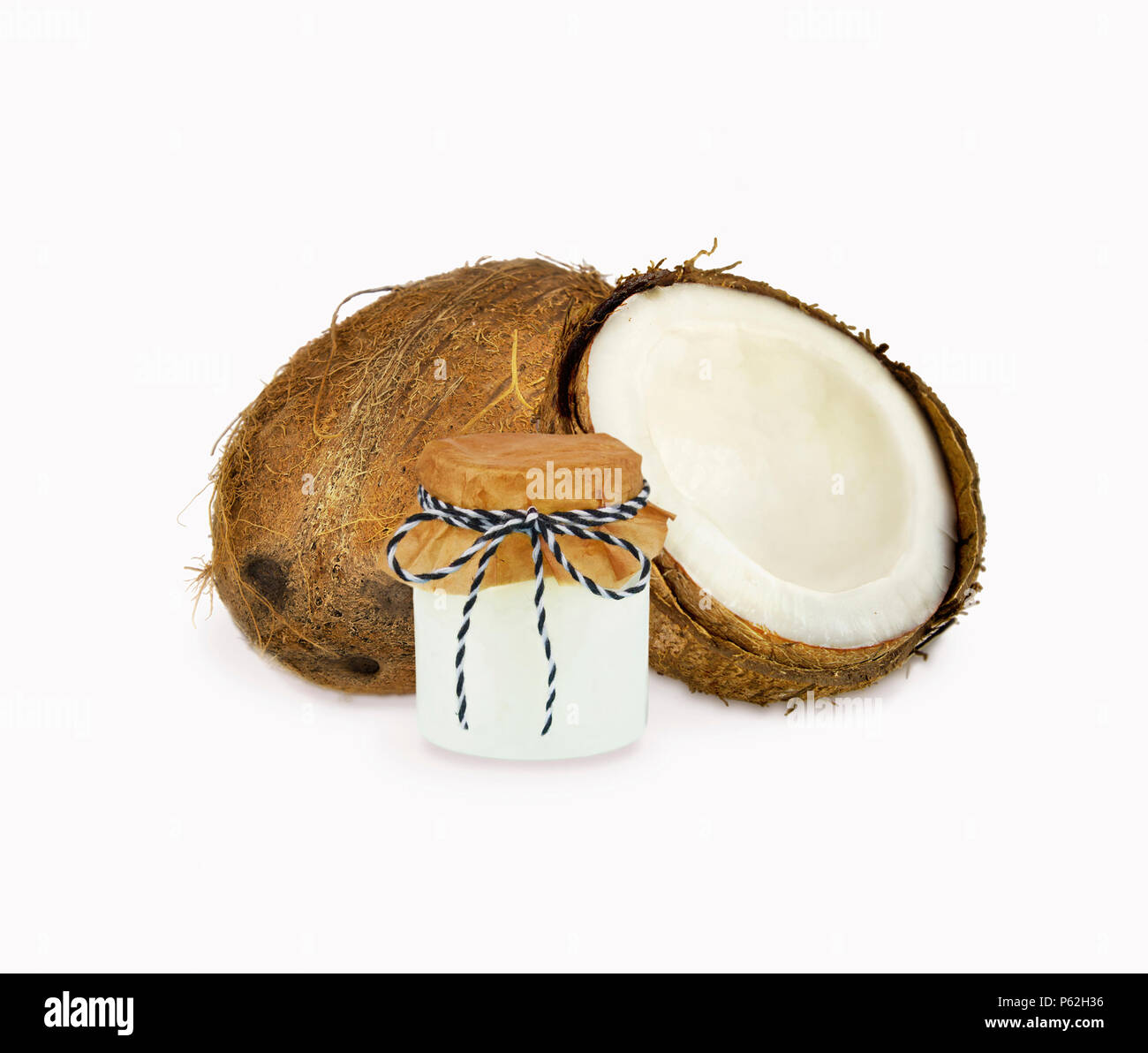 Jar of coconut oil and fresh coconuts isolated on white background ...