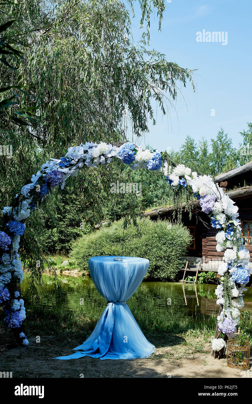Flower arch for outdoor registration in nature with white and blue ...
