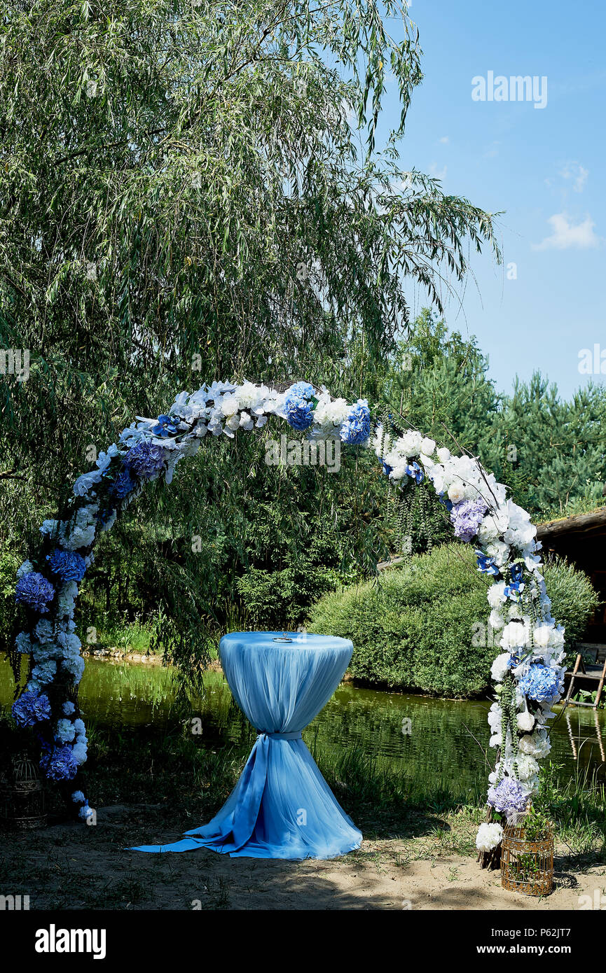 Flower arch for outdoor registration in nature with white and blue ...
