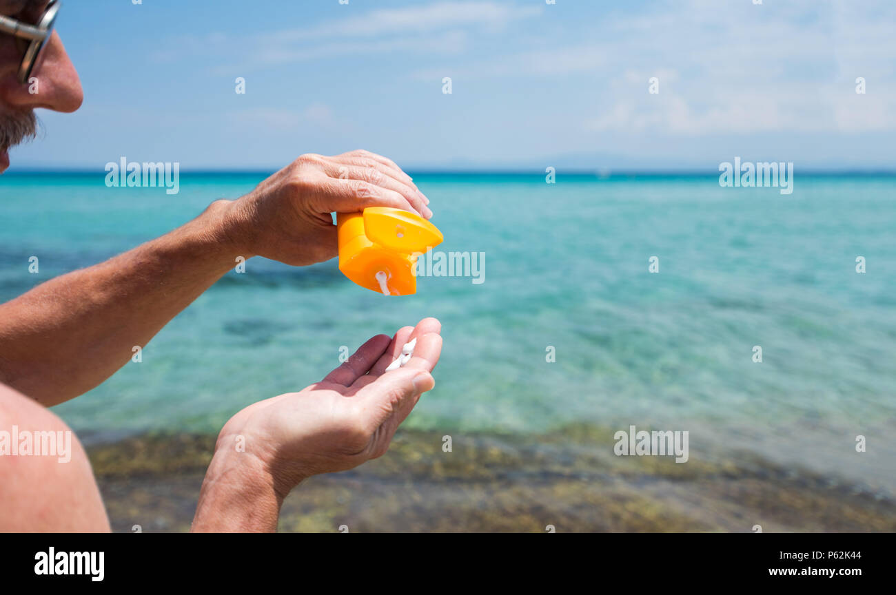 Old man sunbathing on beach hi-res stock photography and images - Alamy