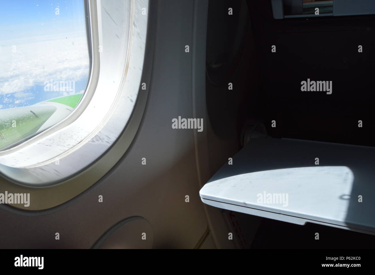 The window of the plane and a table, travel concept Stock Photo - Alamy