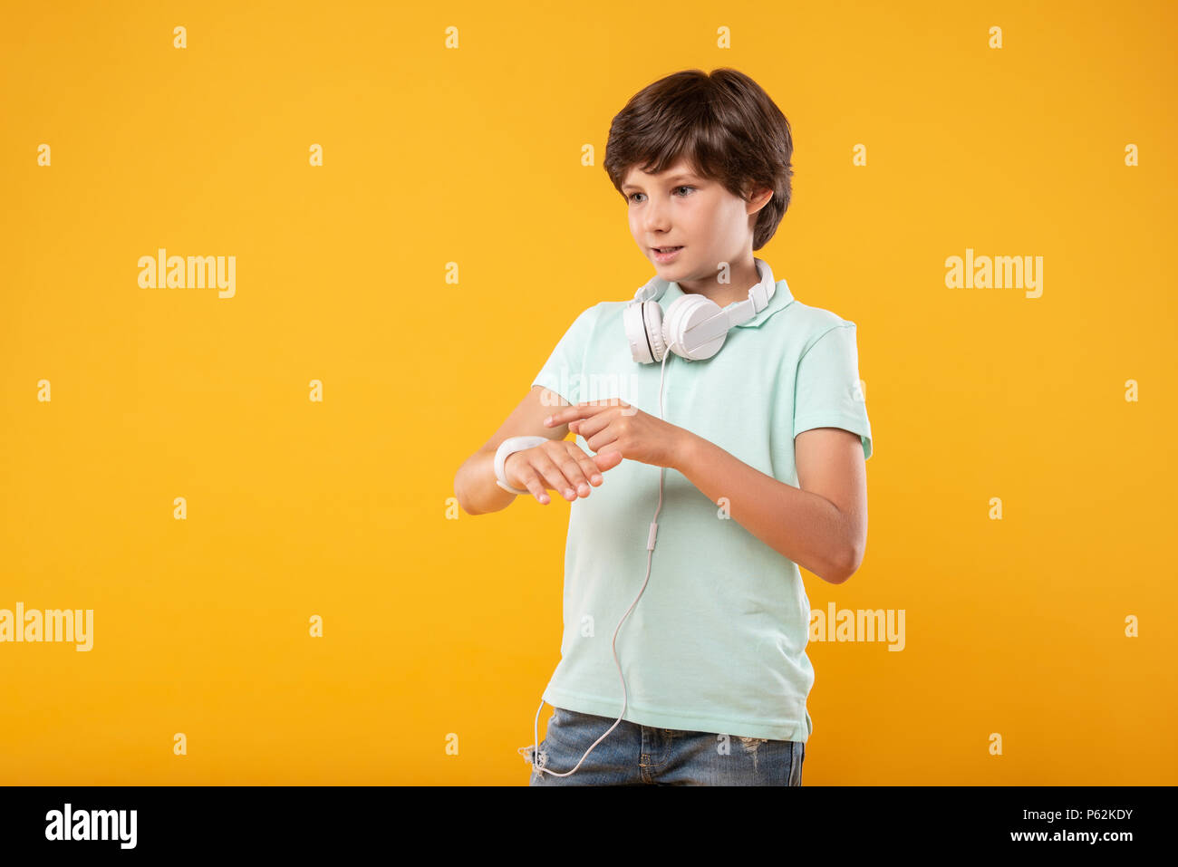 Thoughtful boy wearing a modern watch Stock Photo - Alamy