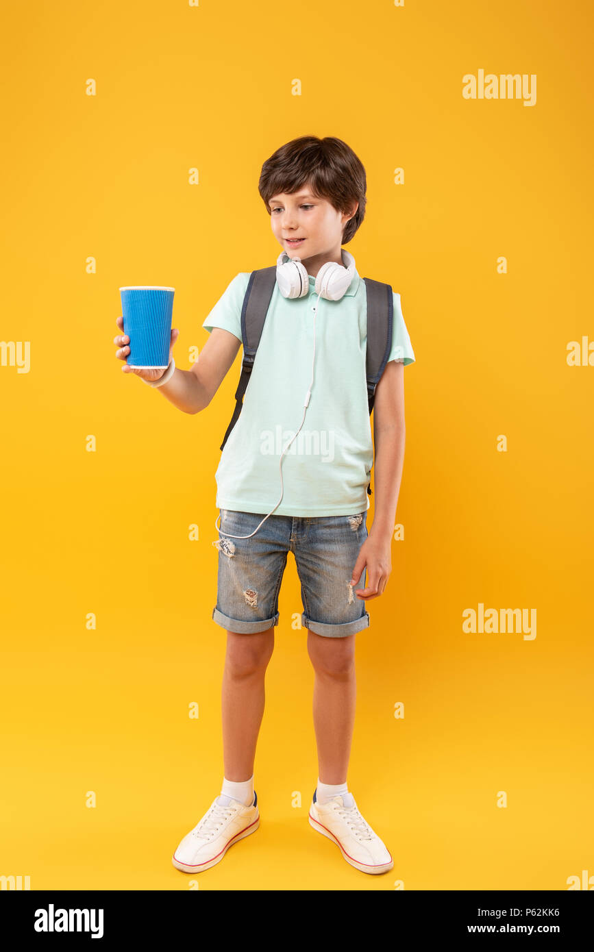 Boy holding a cup hi-res stock photography and images - Alamy