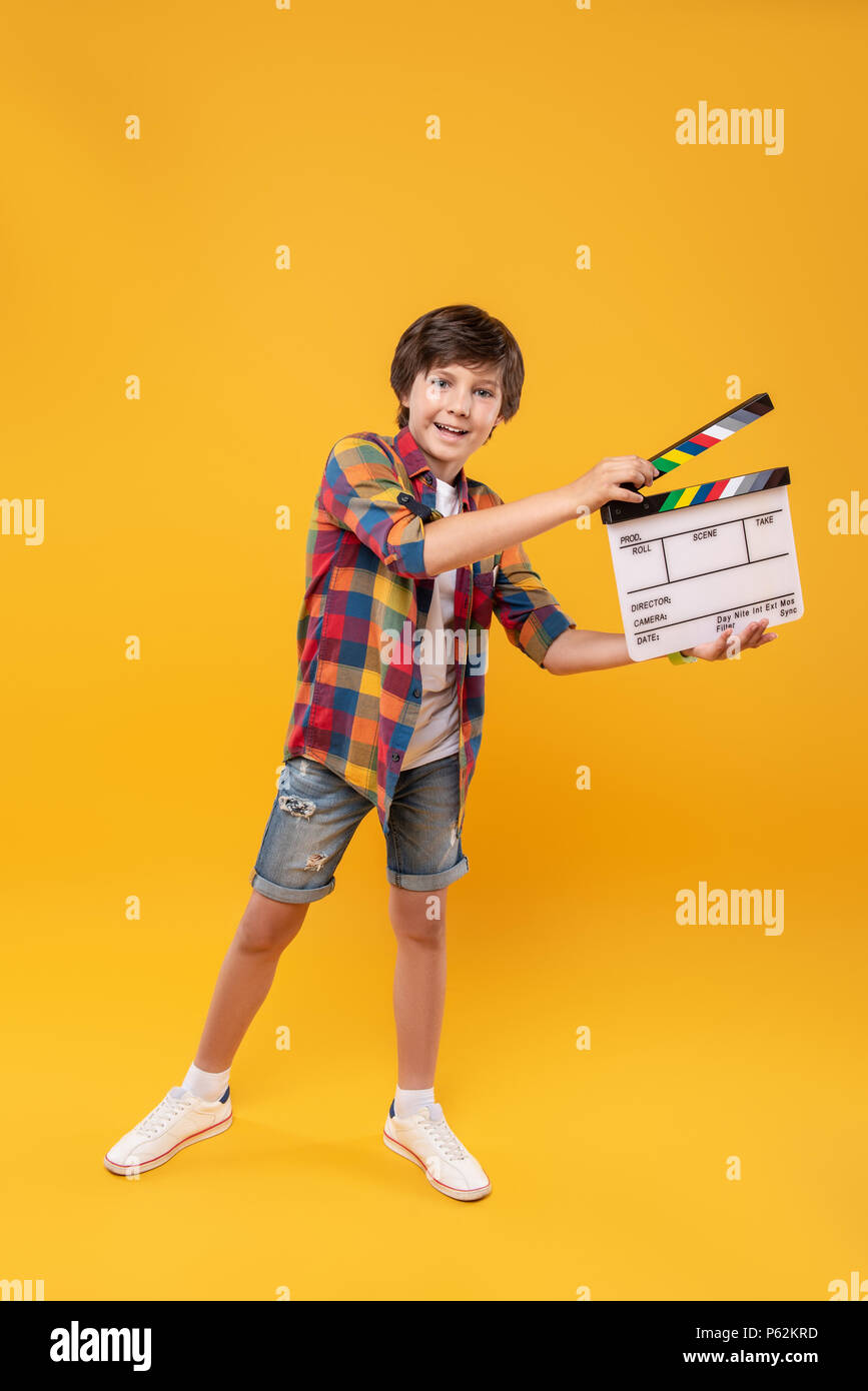 Exuberant boy making a film Stock Photo - Alamy