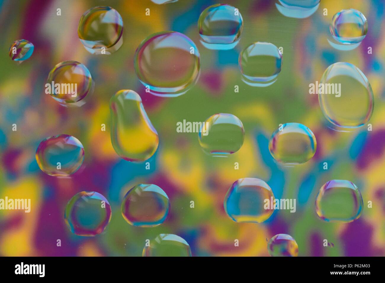 Oil on glass images colourful shapes and shades .ideal for background ...